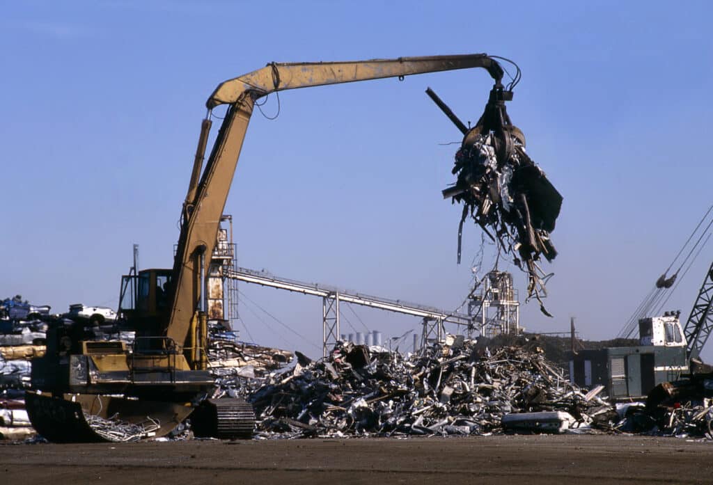 How Is Material Handling Equipment Used in Scrap Yards?